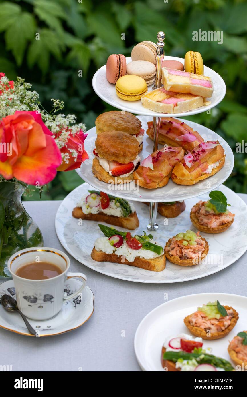 Traditional afternoon tea with canapes and cakes Stock Photo - Alamy