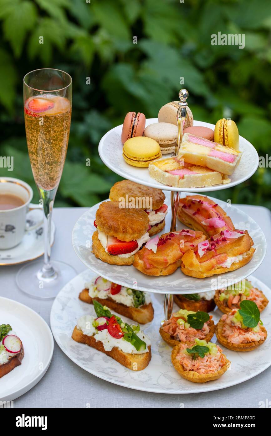 Traditional afternoon tea with canapes and cakes Stock Photo - Alamy