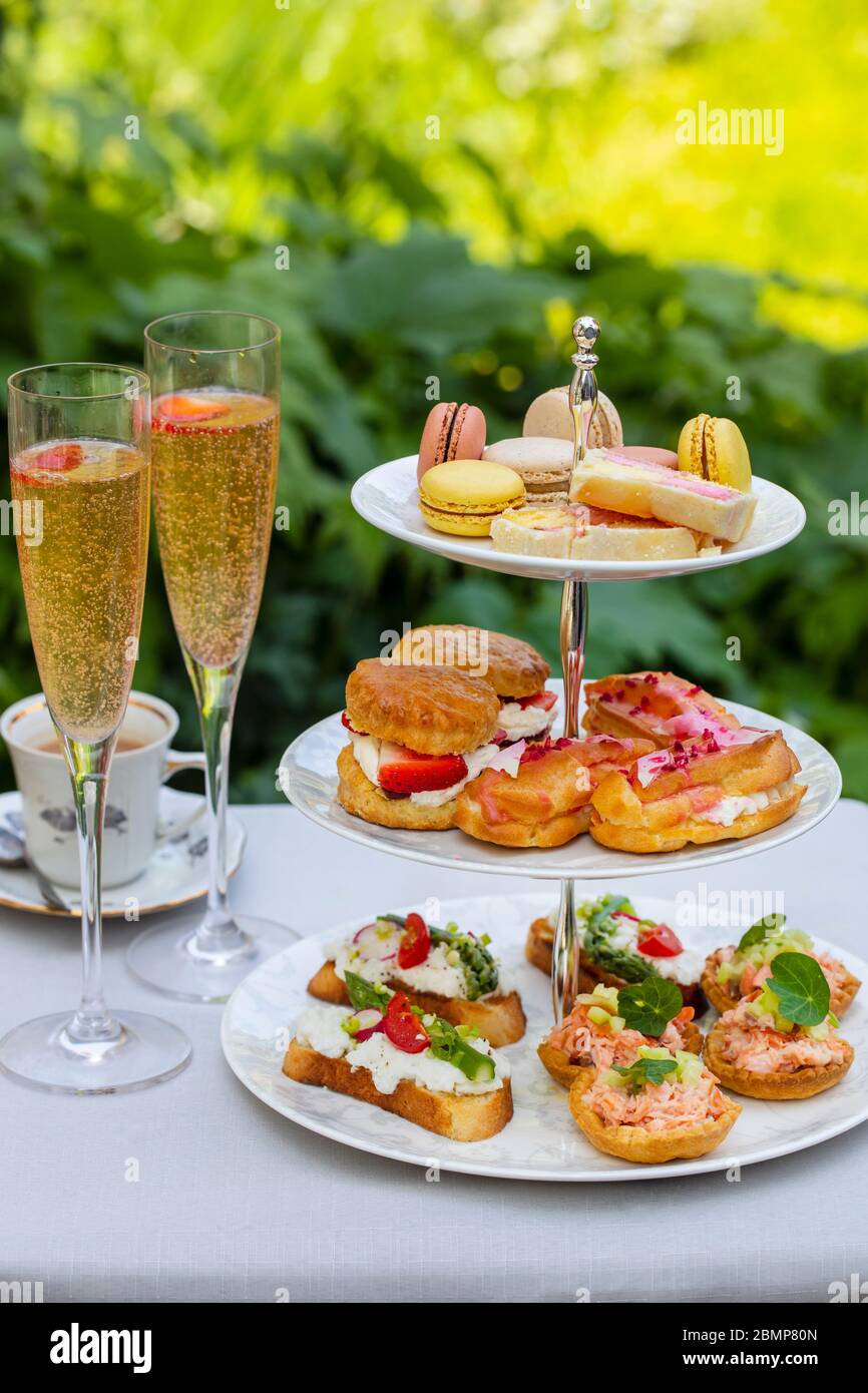 Traditional afternoon tea with canapes and cakes Stock Photo - Alamy