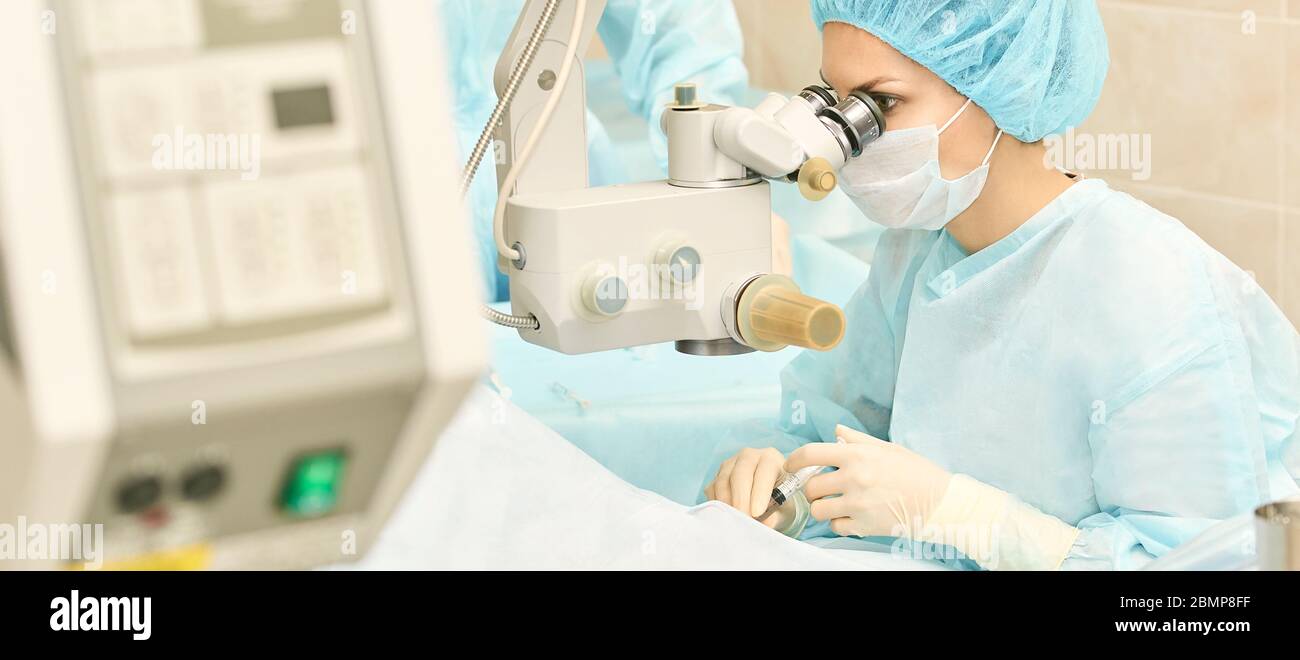 Ophthalmology laser microscope operation. Doctor in clinic. Patient ...