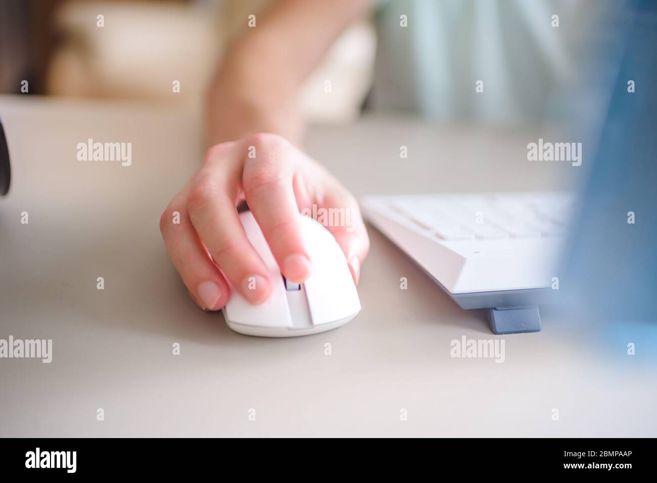 close up hand business man using mouse and laptop in office with ...