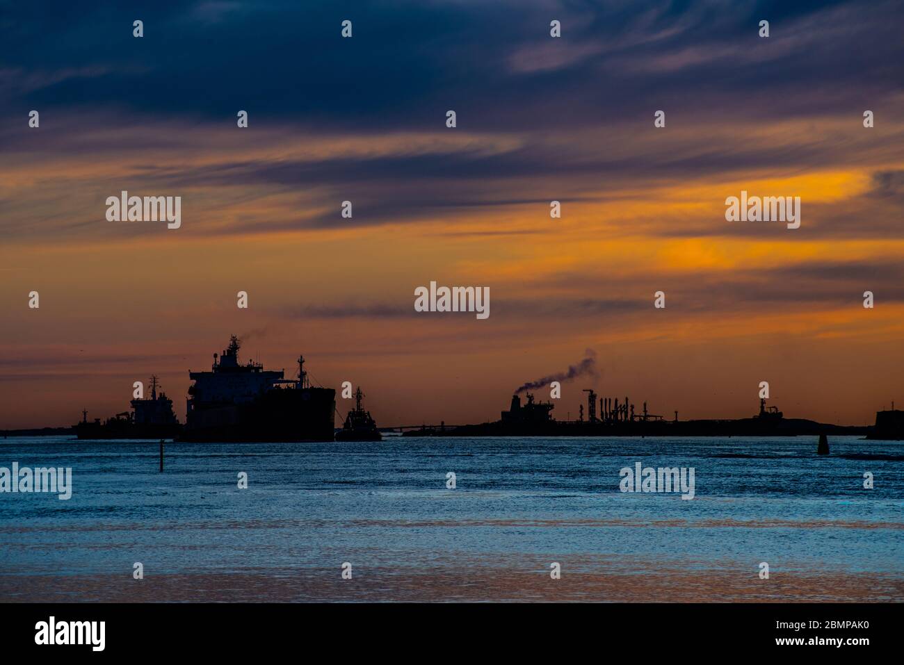 Ships at the port at sunset Stock Photo - Alamy