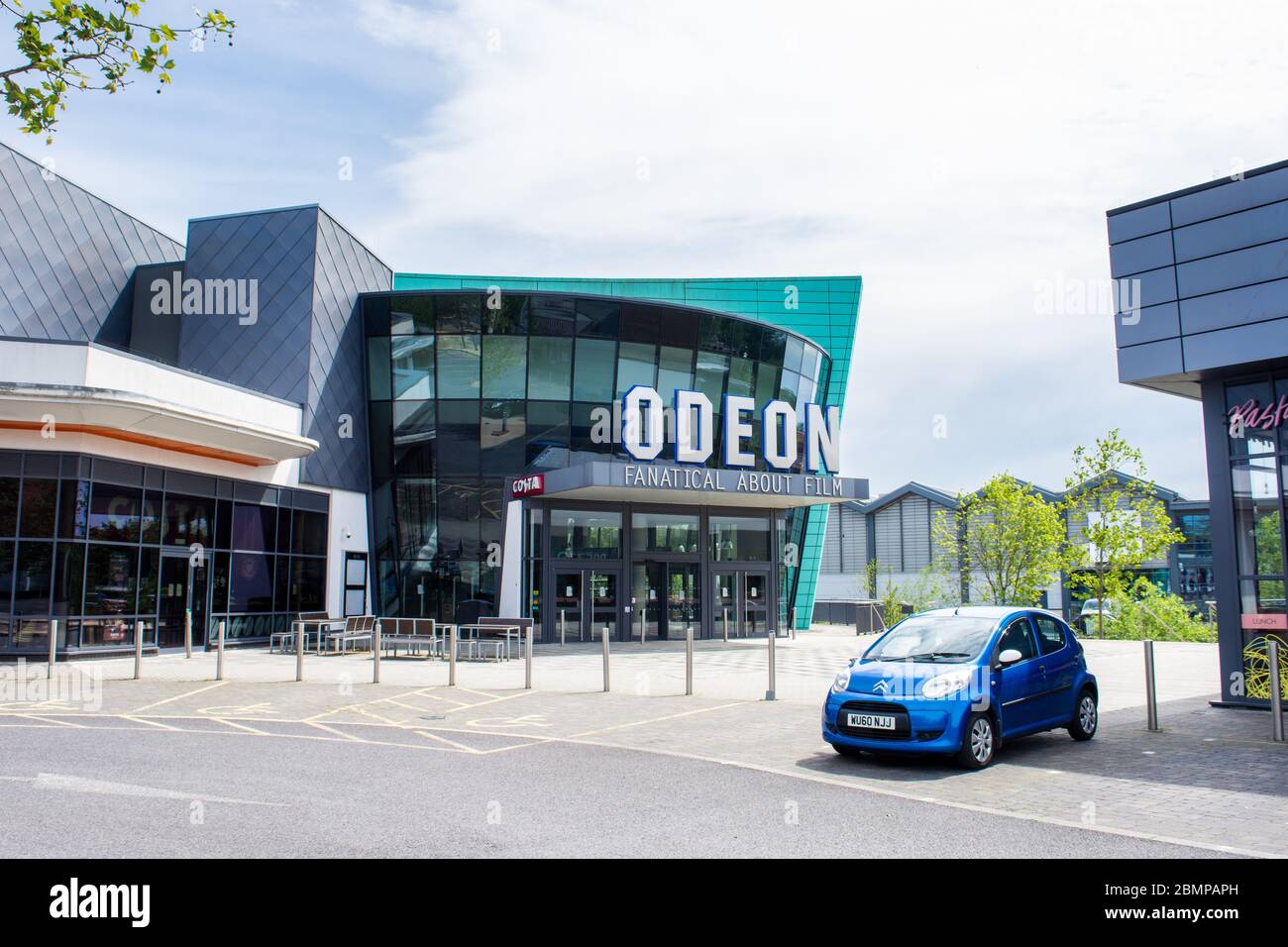 The front of an Odeon cinema next to a Costa coffee shop with a single ...