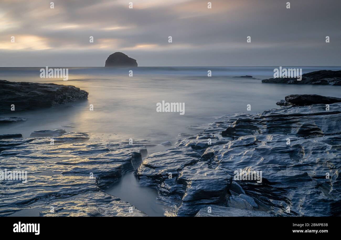 Trebarwith Strand at sunset with a high tide looking towards Gull Rock ...
