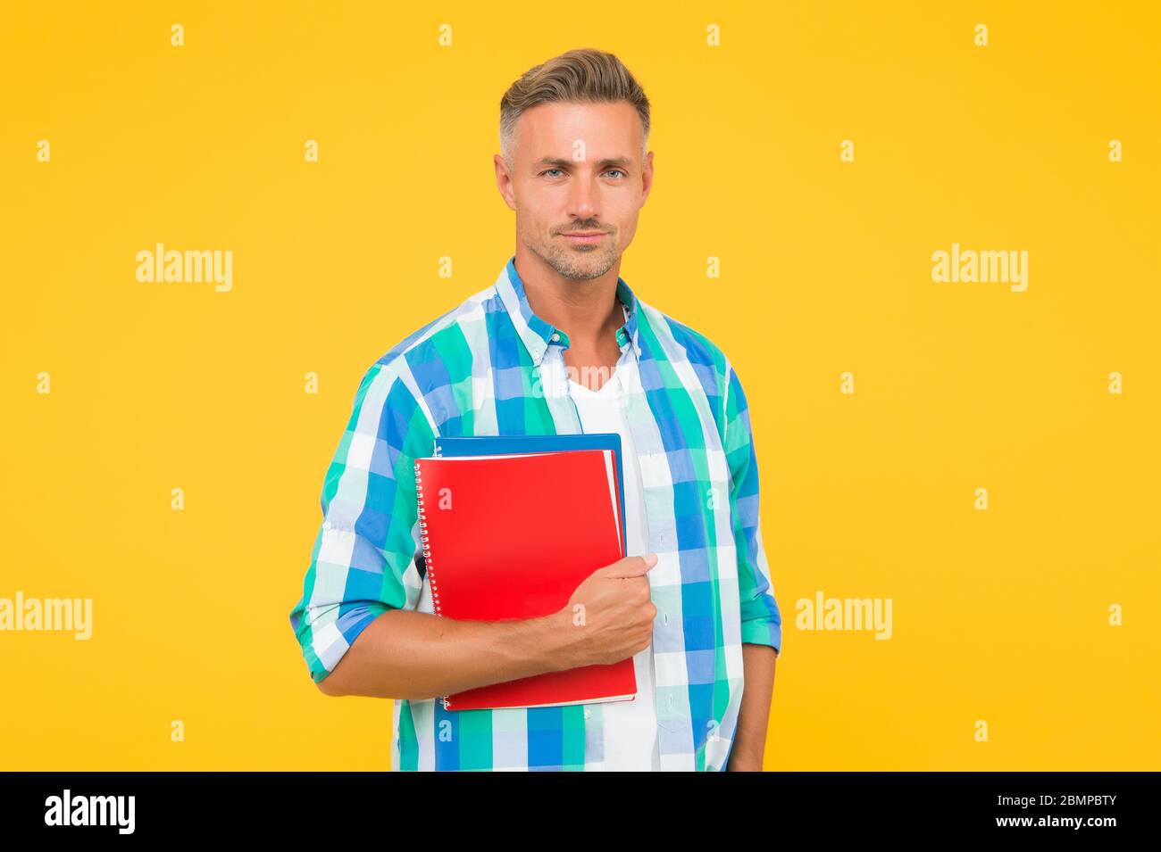 man with folder yellow background. Businessman hold book for notes. guy ...