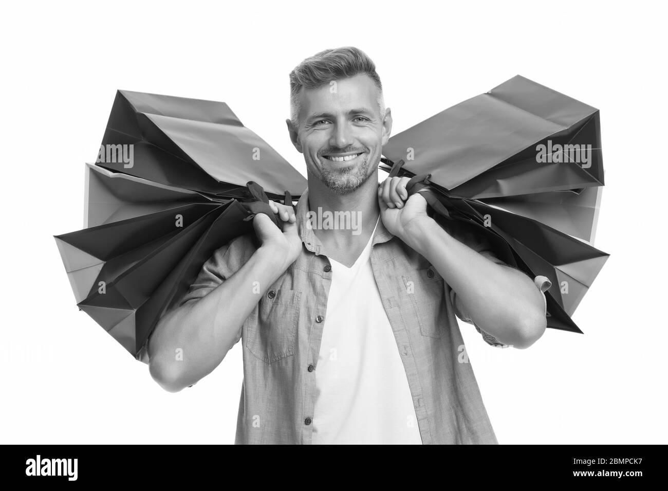 avid shopaholic. happy man with packages after shopping. handsome man ...