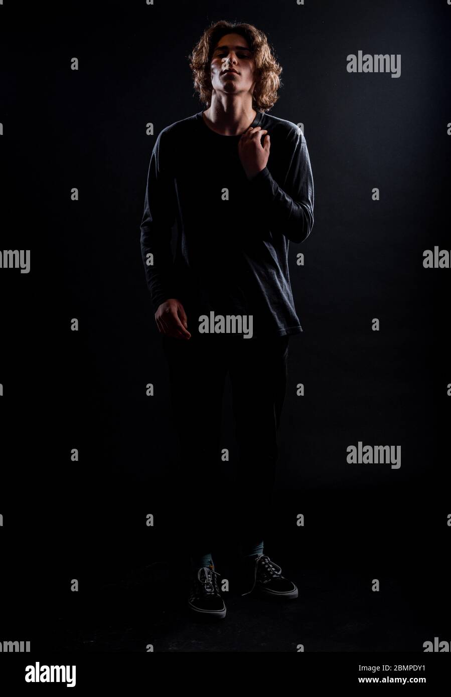 Portrait of a handsome male model posing in cool fashionable clothing ...