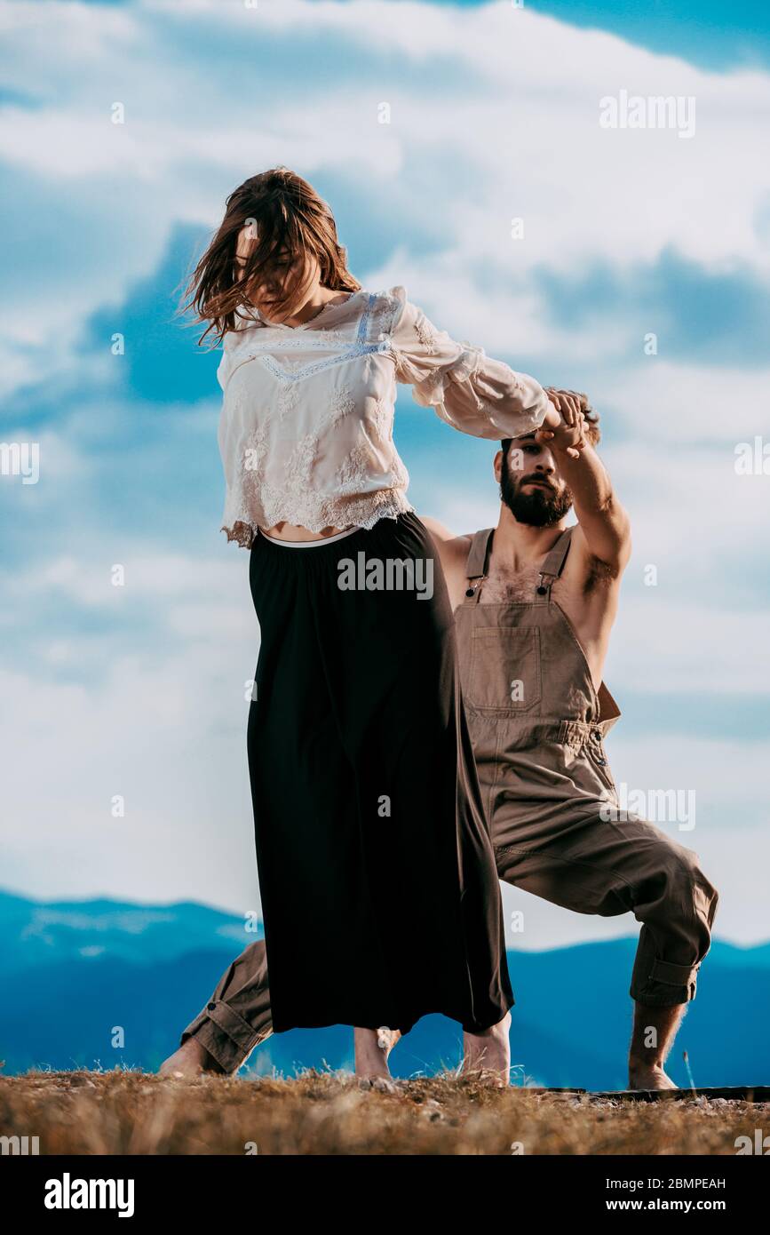 Sensual couple performing an artistical and emotional contemporary ...
