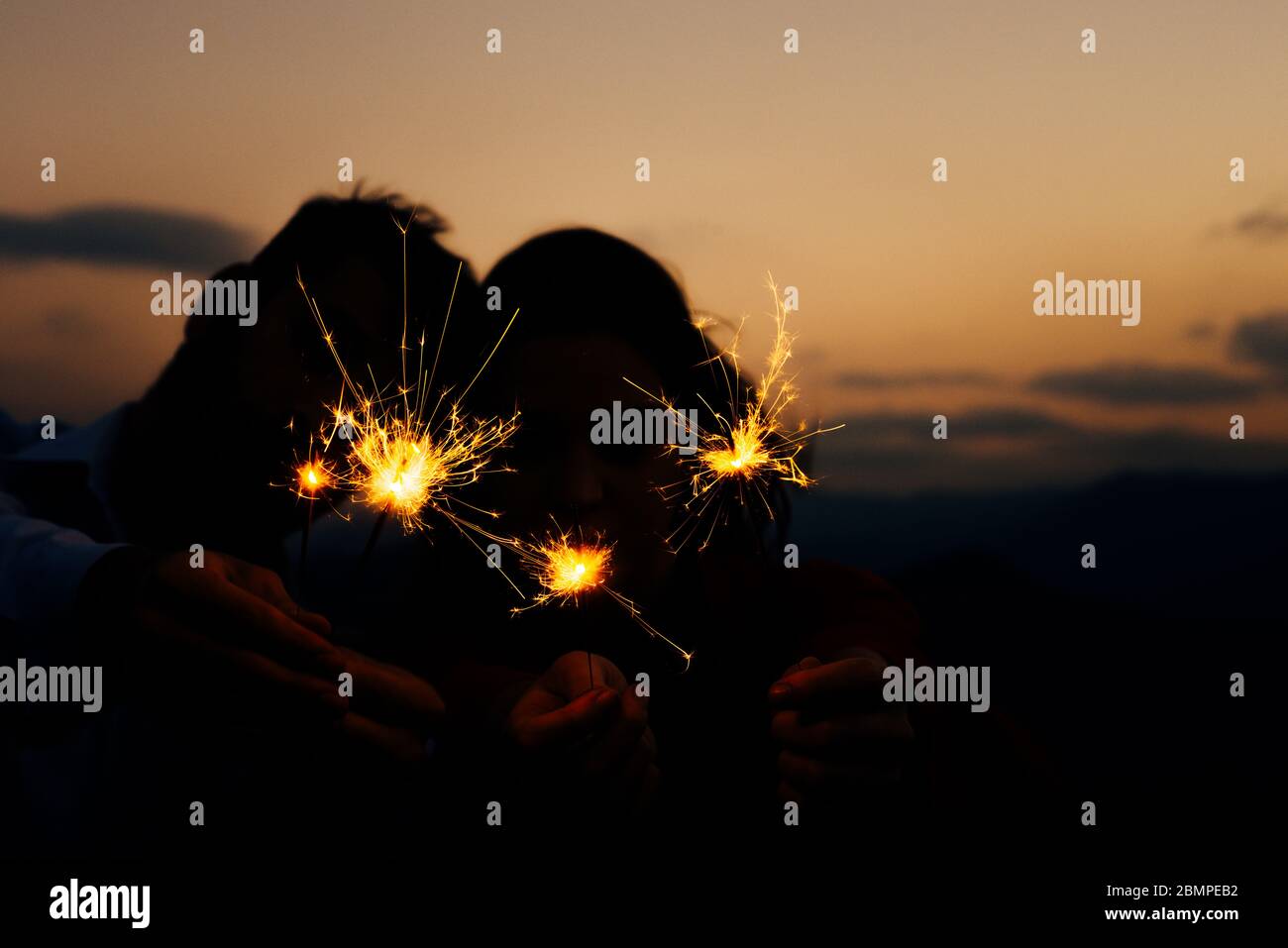 Sparklers party sunset in summer hi-res stock photography and images ...