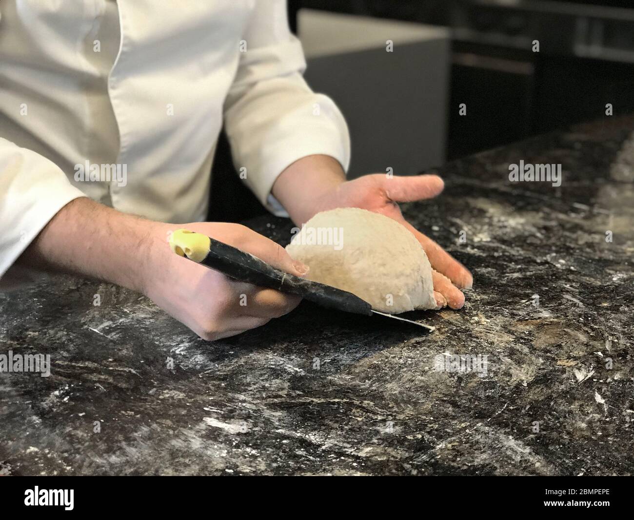 Chef or person prepairing dough pastry for home made fresh bread ...