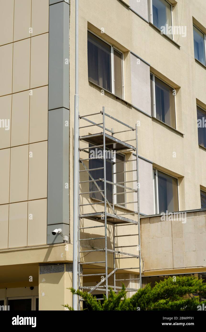 Modern scaffolding outside the building. Assembled sections of ...