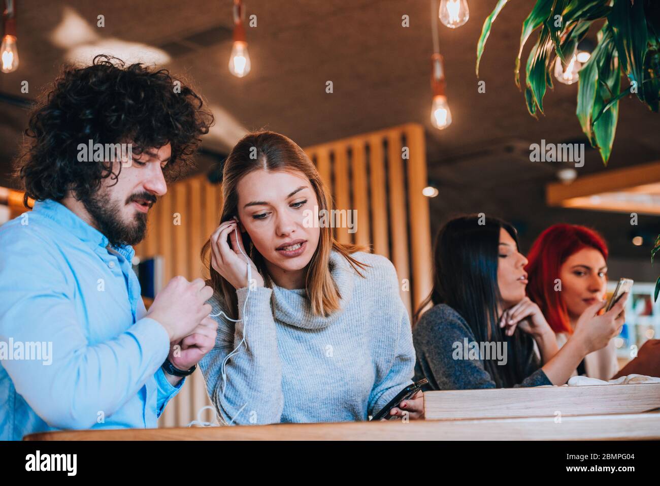 Attractive people having a pleasant conversation at a restaurant Stock ...