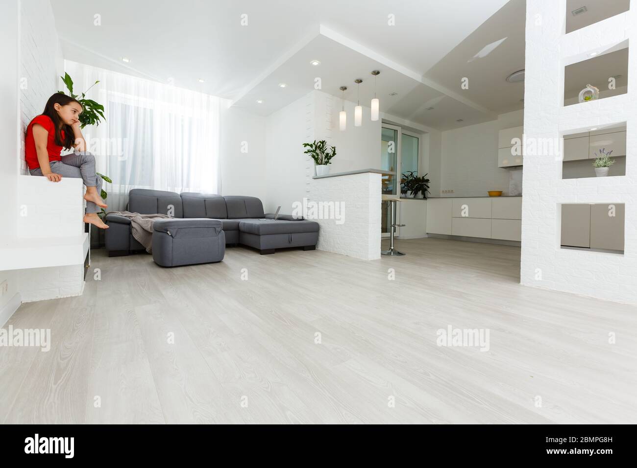 A person in a white room Stock Photo - Alamy