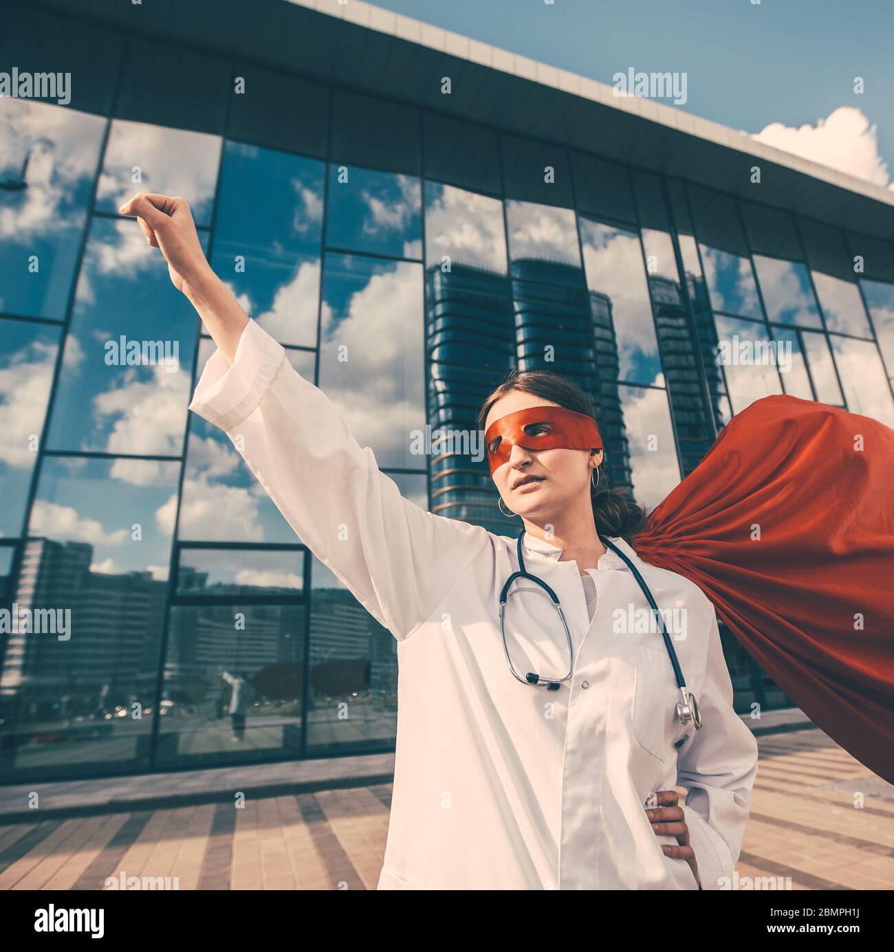 female doctor in a superhero Cape is ready to help Stock Photo - Alamy