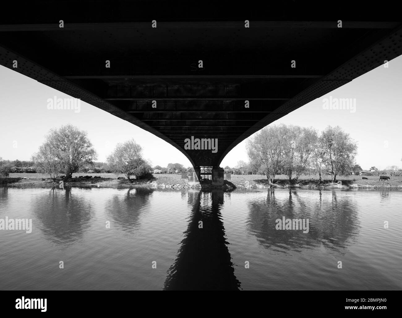 Long single span bridge across a river Stock Photo - Alamy