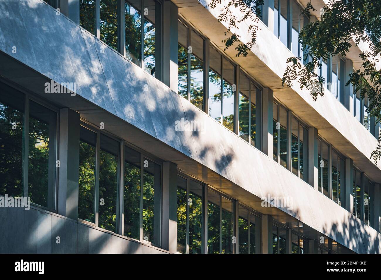 Facade of an 80's office building under the noon light Stock Photo - Alamy