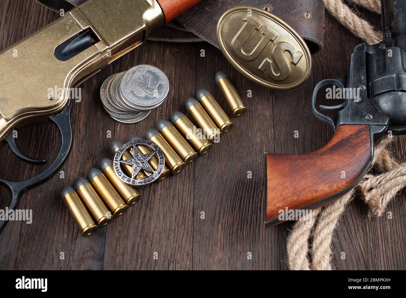Wild west weapons, ammunition and Texas Rangers star badge with silver ...