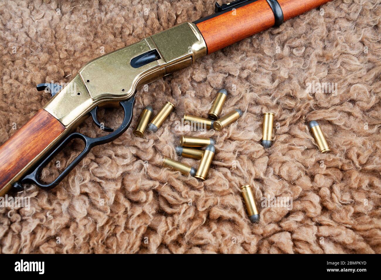 Wild west gun and ammunition on skins backgrond Stock Photo - Alamy