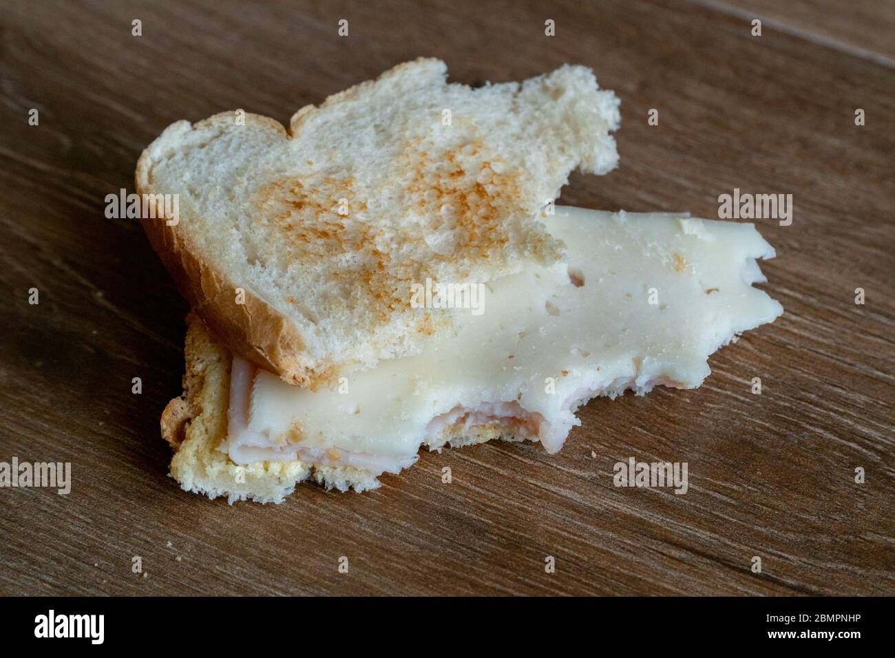 Bread tossed to the floor. Half Eaten Sandwich thrown on the floor ...
