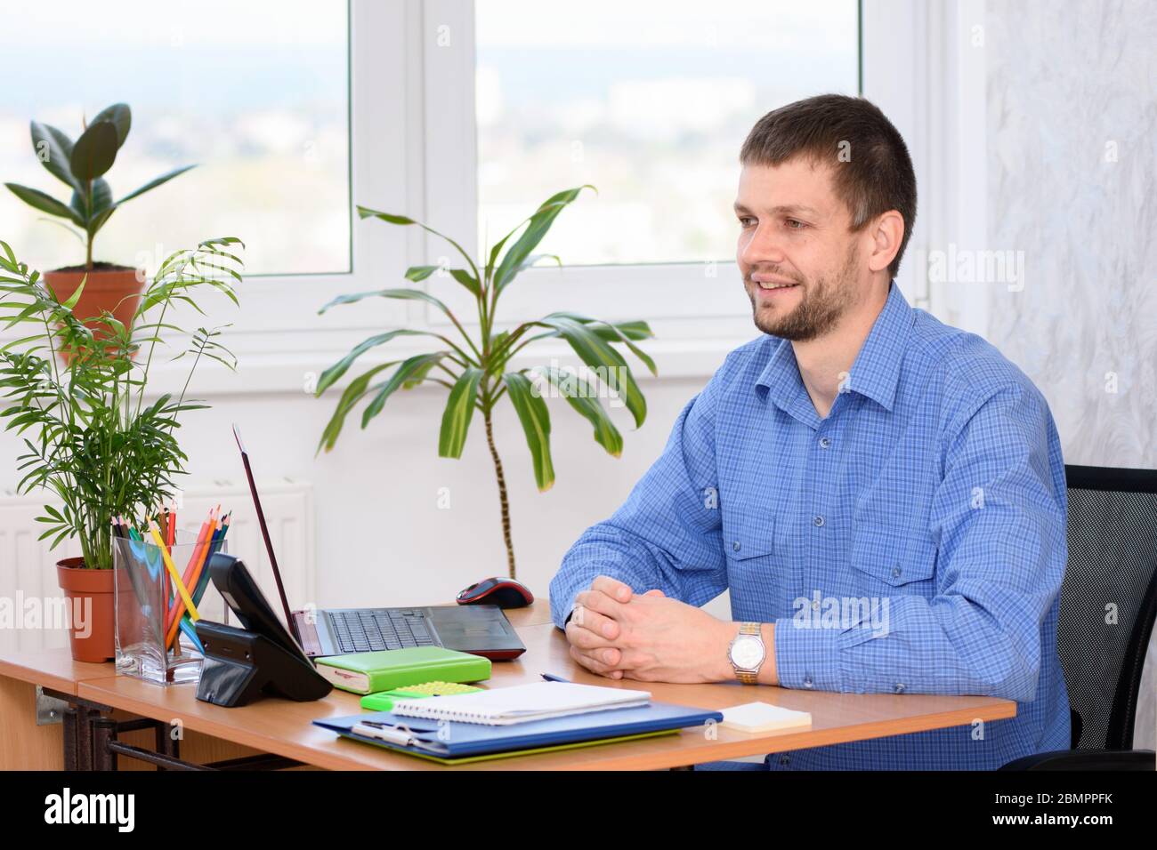 The office employee at the workplace receives the client Stock Photo ...