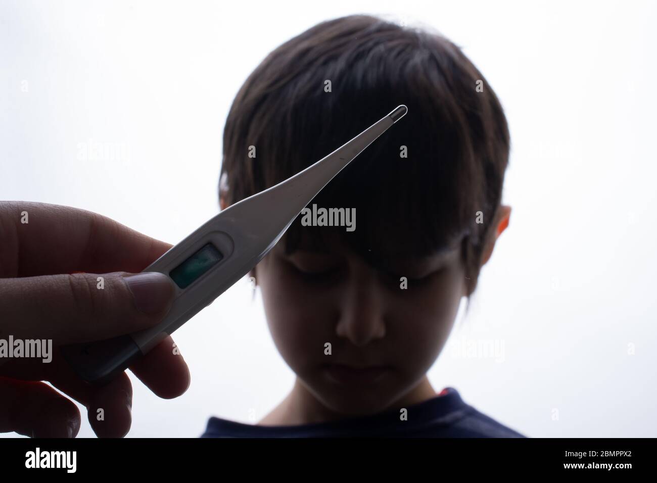 measuring Fever temperature. Child with thermometer. World pandemic ...