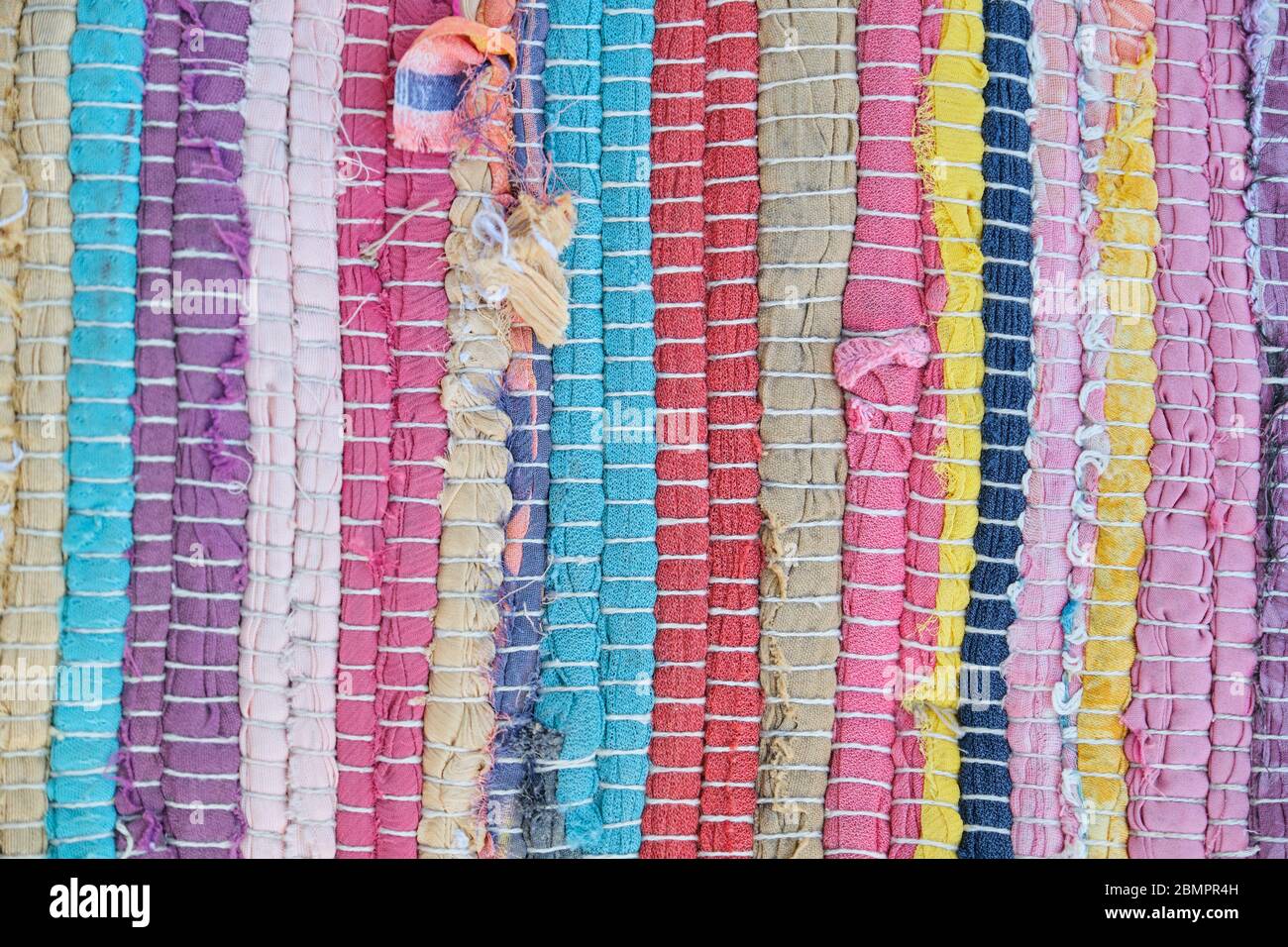 Close-up of rug woven from colored threads Stock Photo - Alamy