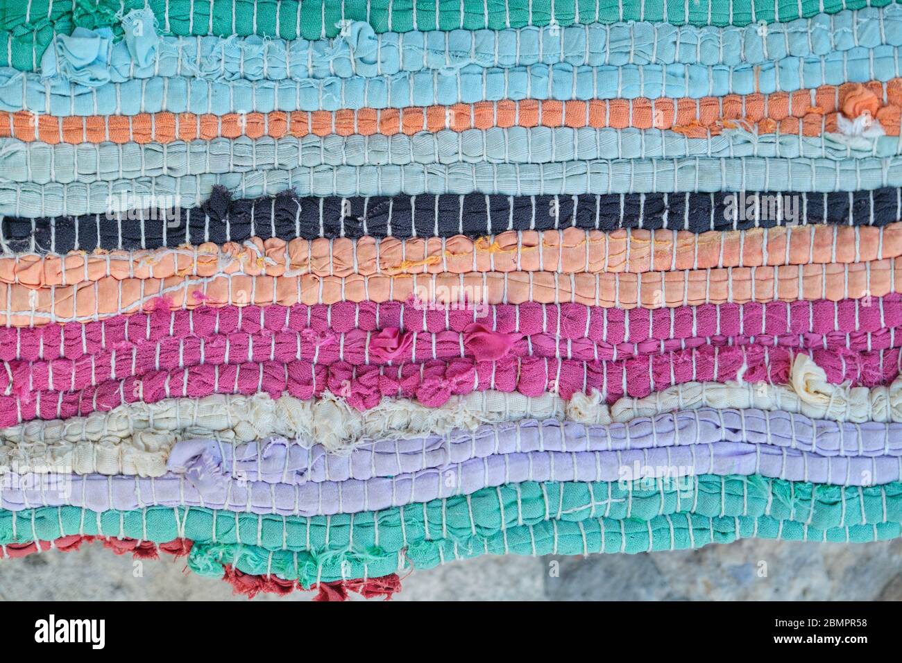 Close-up of rug woven from colored threads Stock Photo - Alamy