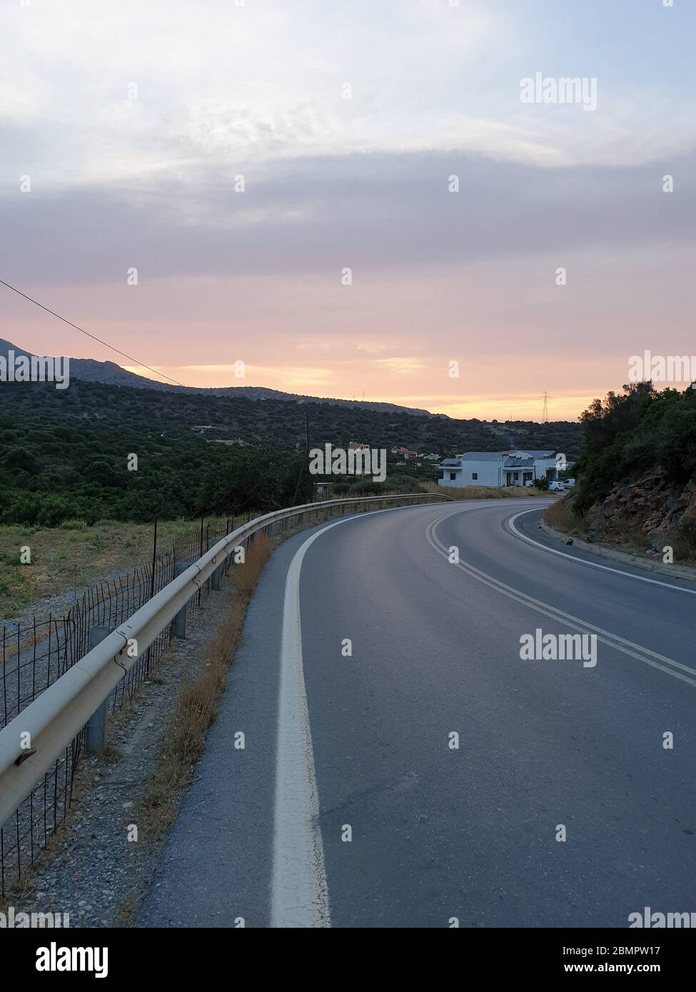 Crete road and mountains, evening sunset Stock Photo - Alamy