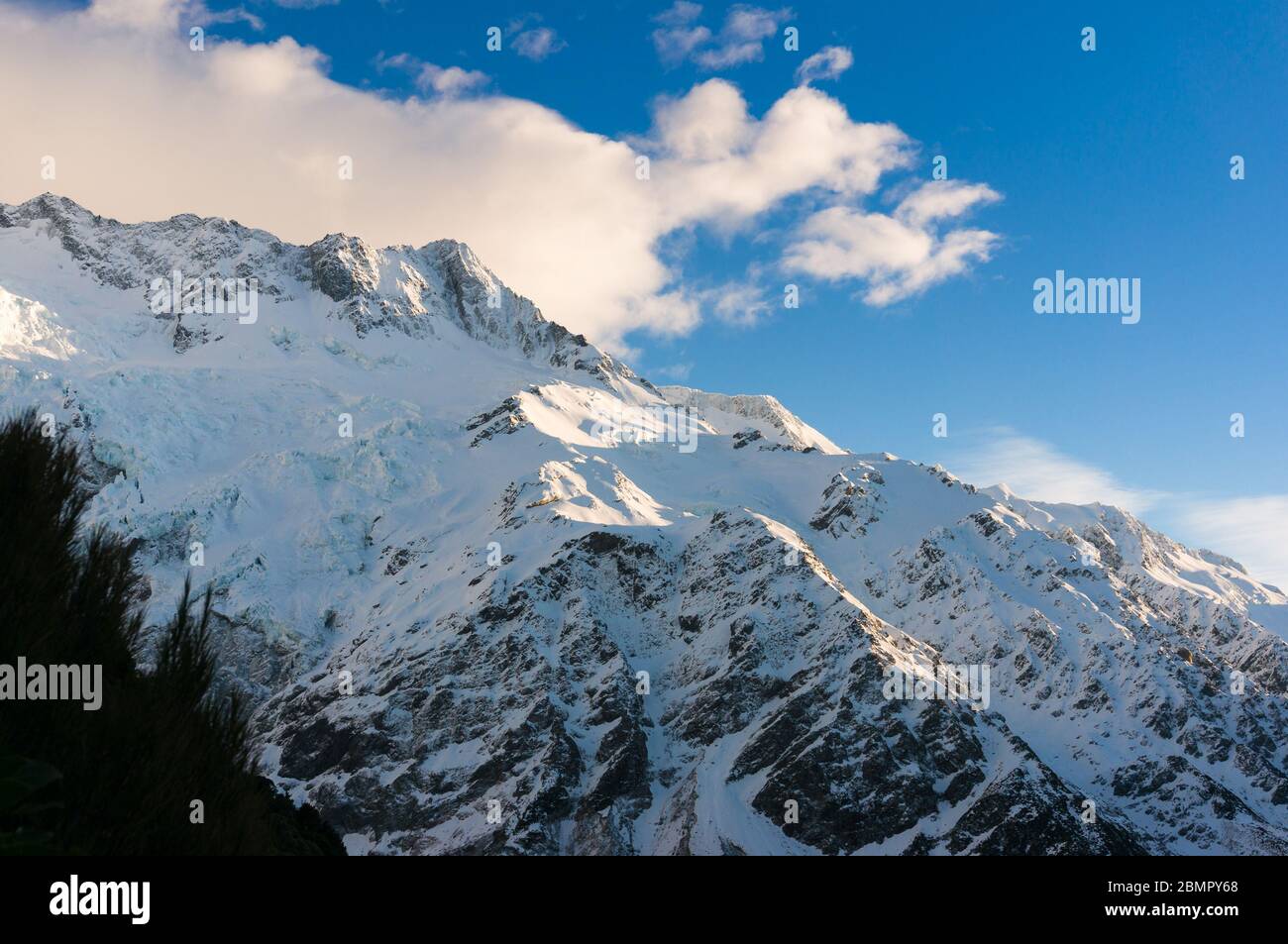 Winter mountain landscape with snow covered mountains and blue sky ...