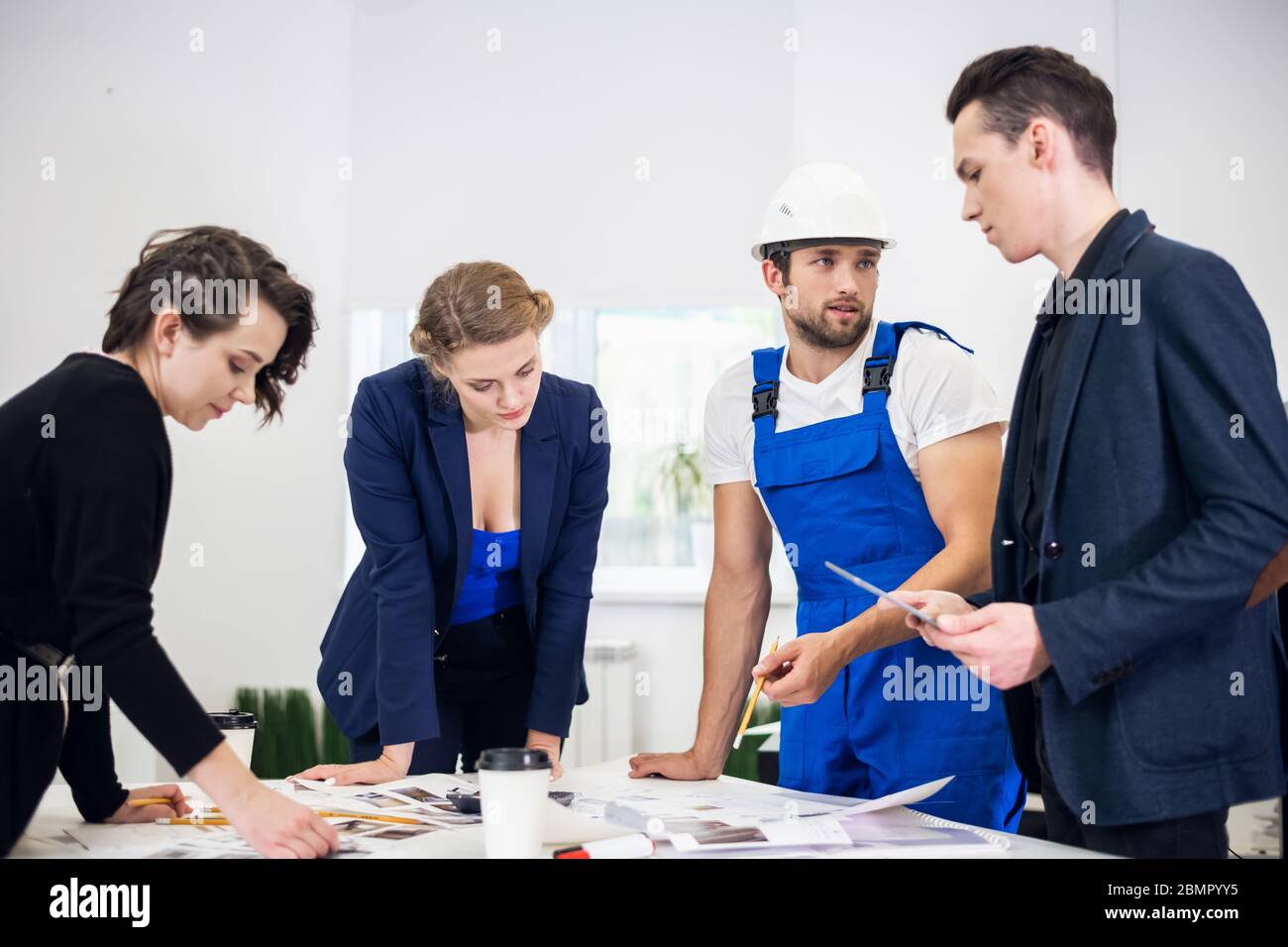 Engineers giving careful consideration to a project Stock Photo - Alamy