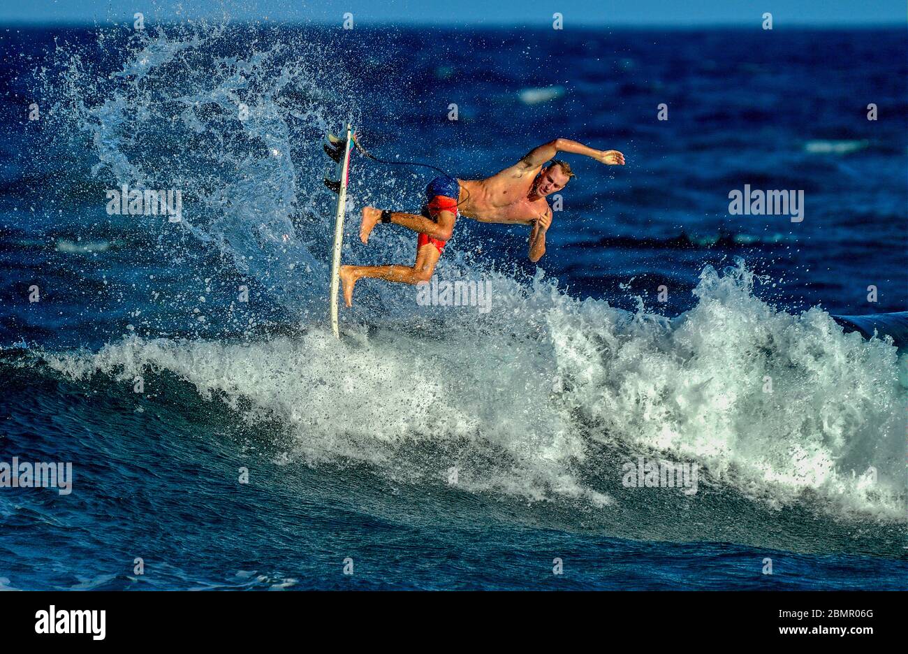 Surfer rides a wave in South Florida Stock Photo - Alamy