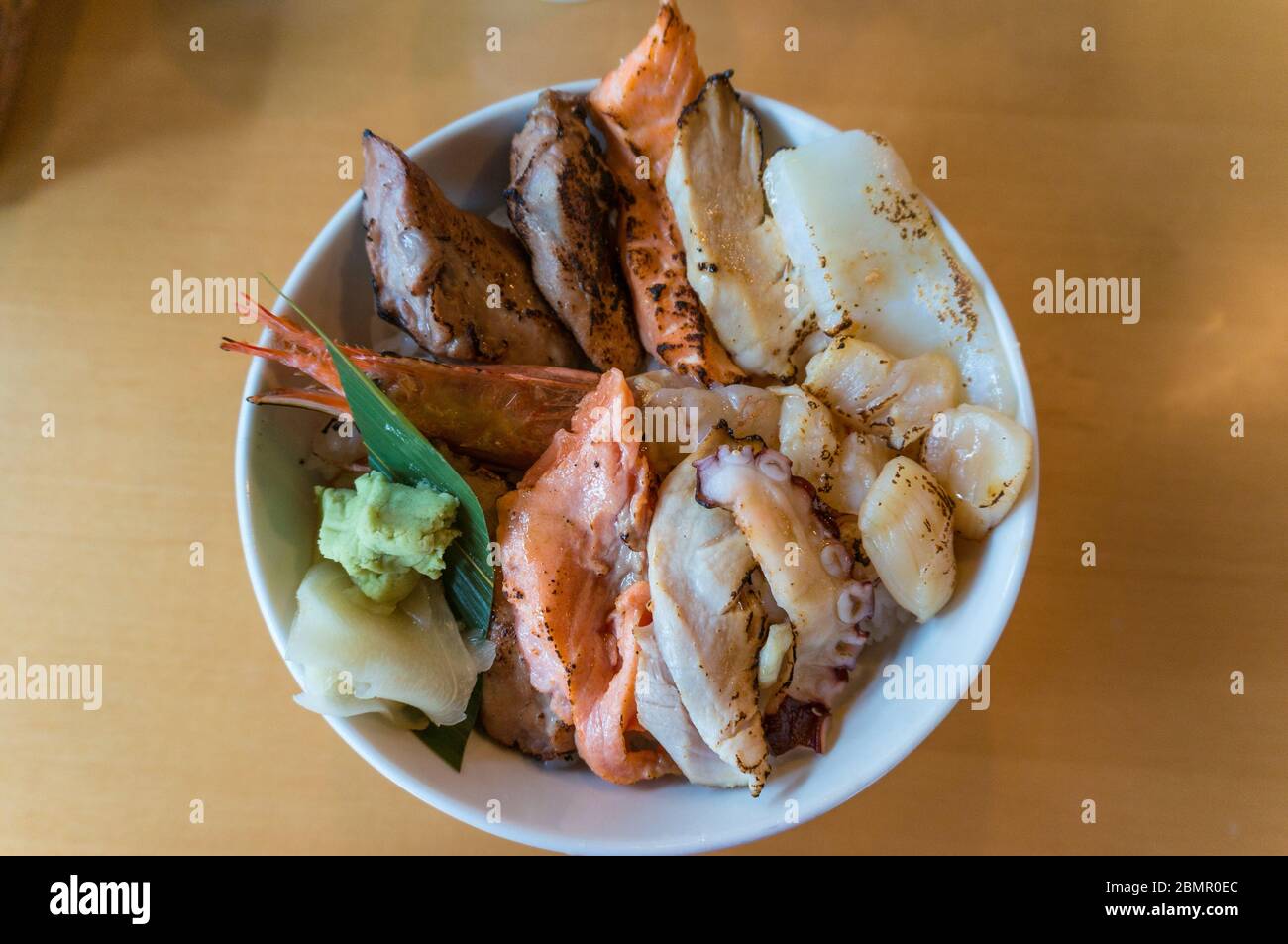 Bowl of fresh seafood. Sashimi plate with fish, prawns octopus and ...