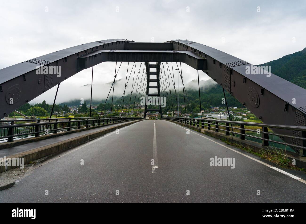 Bridge steel frame with asphalt road. River bridge in Japanese ...