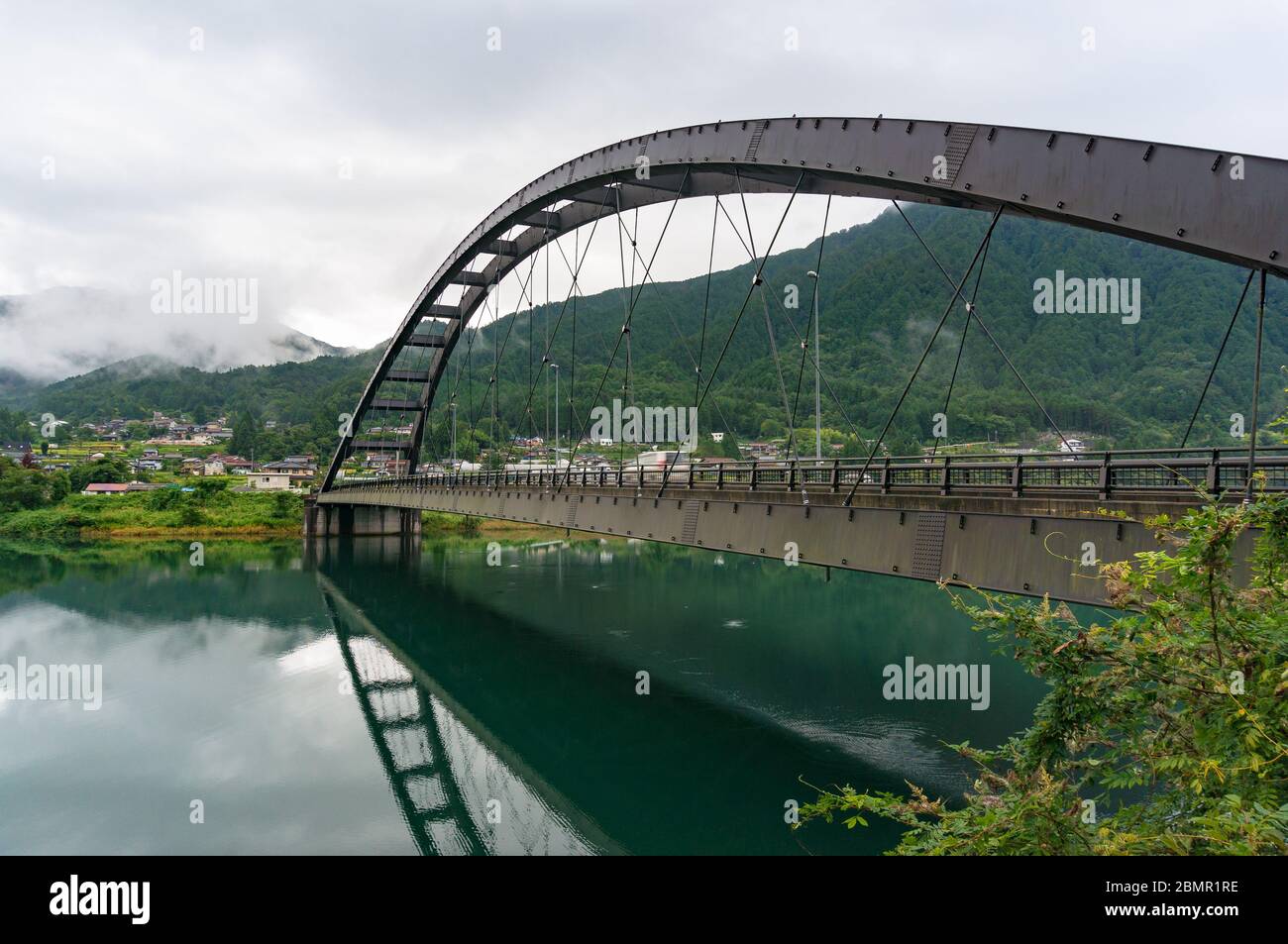 River bridge in Japanese countryside with rural village view. Kiso ...