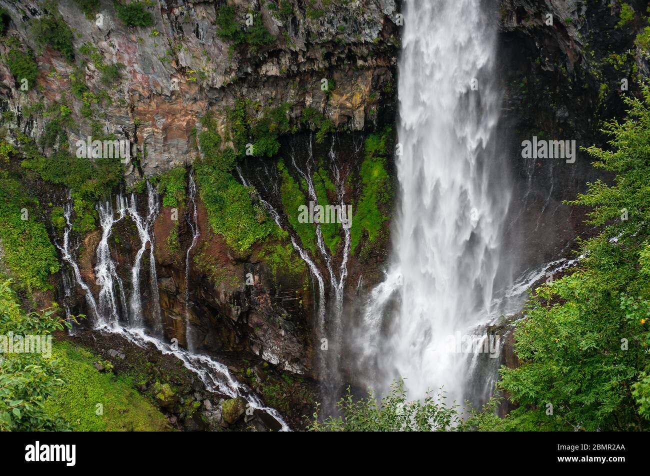 Close up of massive waterfall stream with cliff rocks. Waterfall nature ...