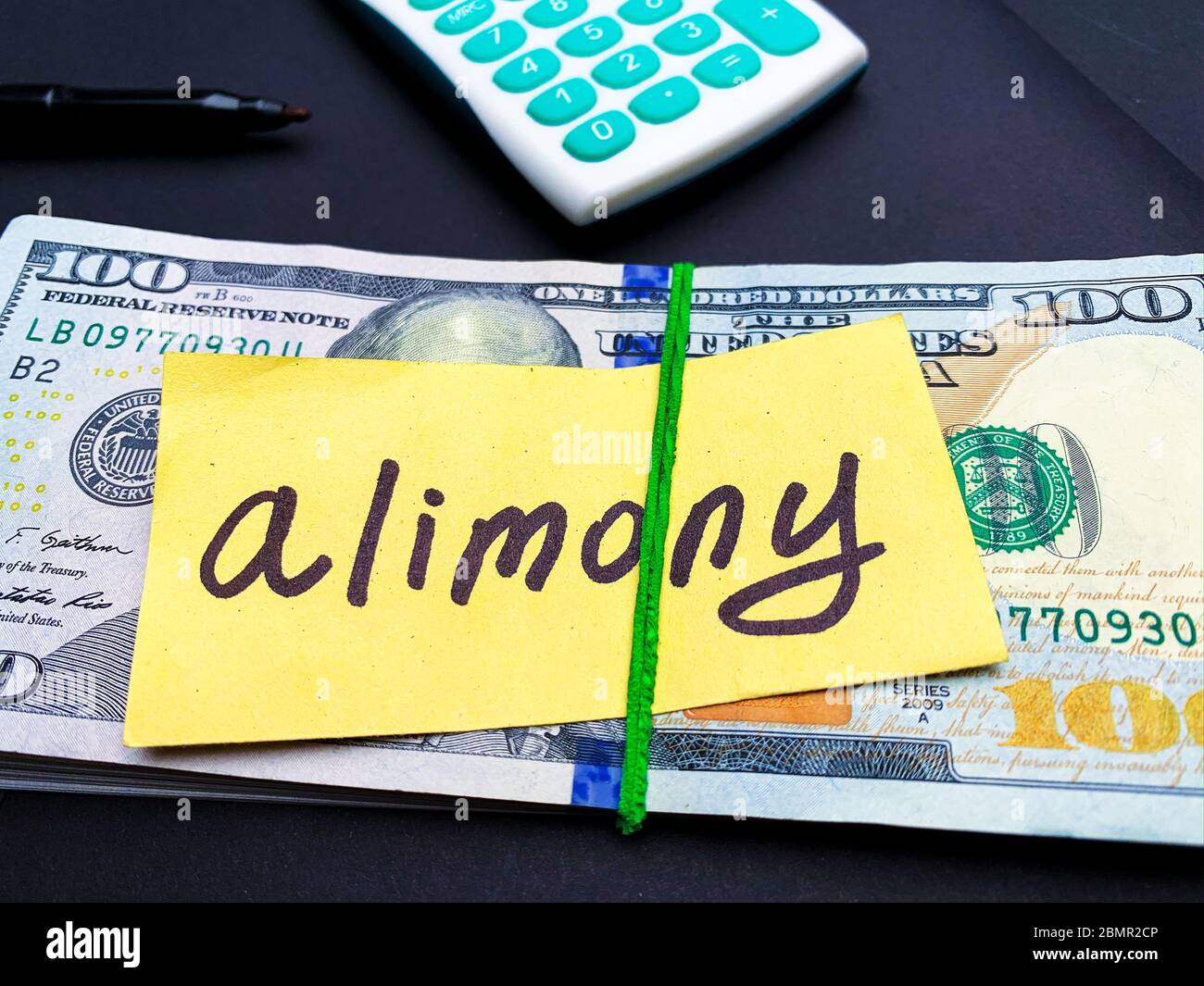 Concept of paying alimony, stack of money on the table Stock Photo - Alamy