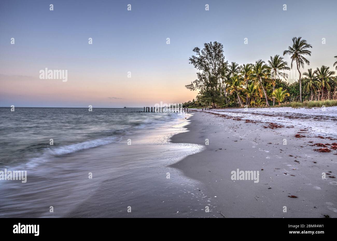Shoreline of Port Royal Beach at sunrise in Naples, Florida Stock Photo ...