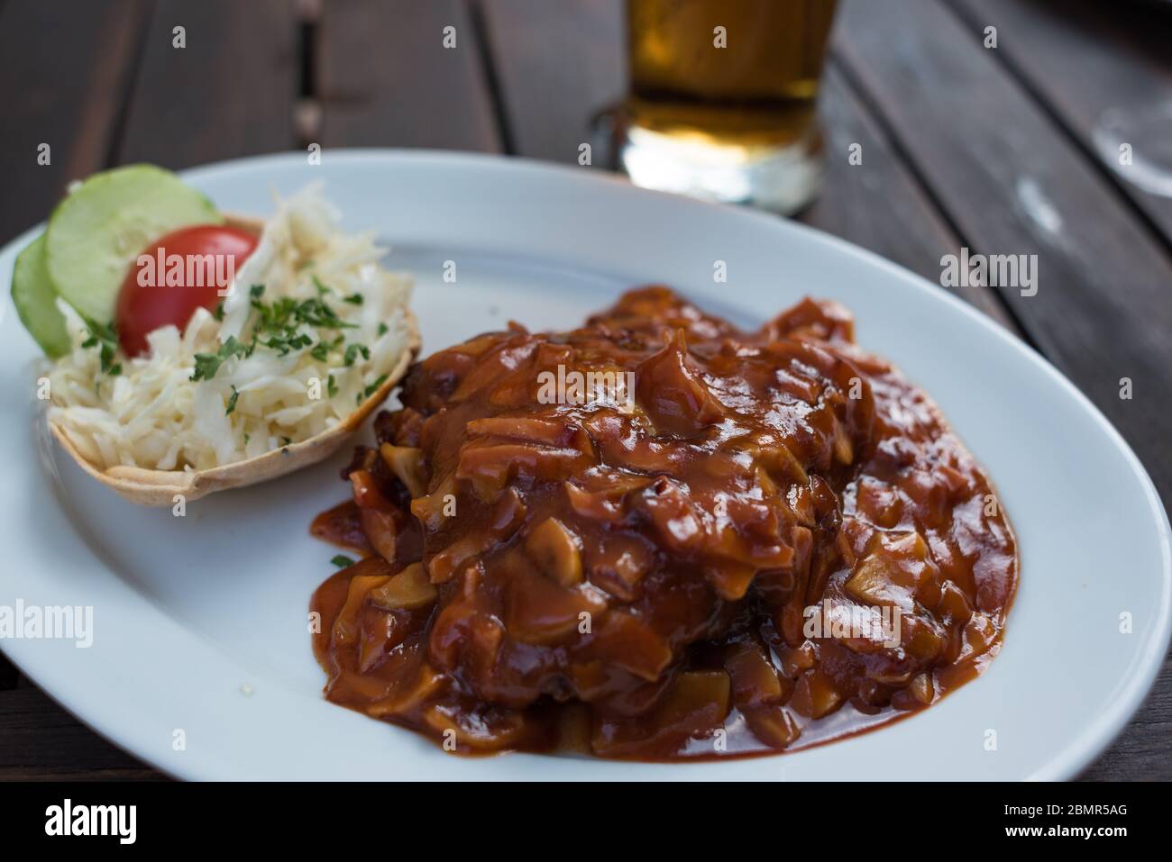Gulash meal, beef stew served with cabbage salad. Traditional Czech ...