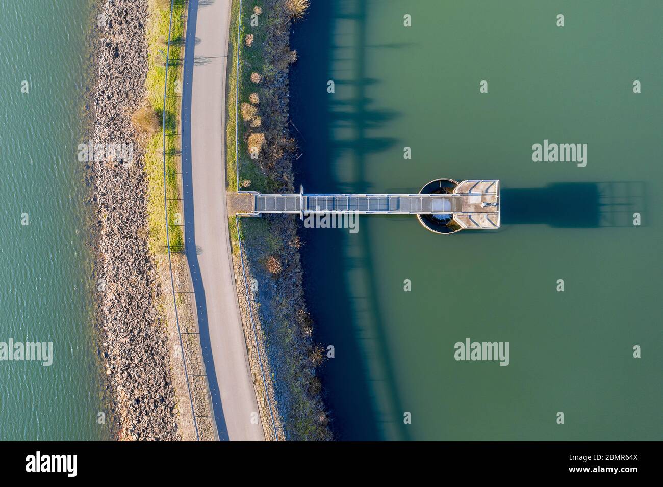 stone water dam and overflow in the sun from above Stock Photo - Alamy