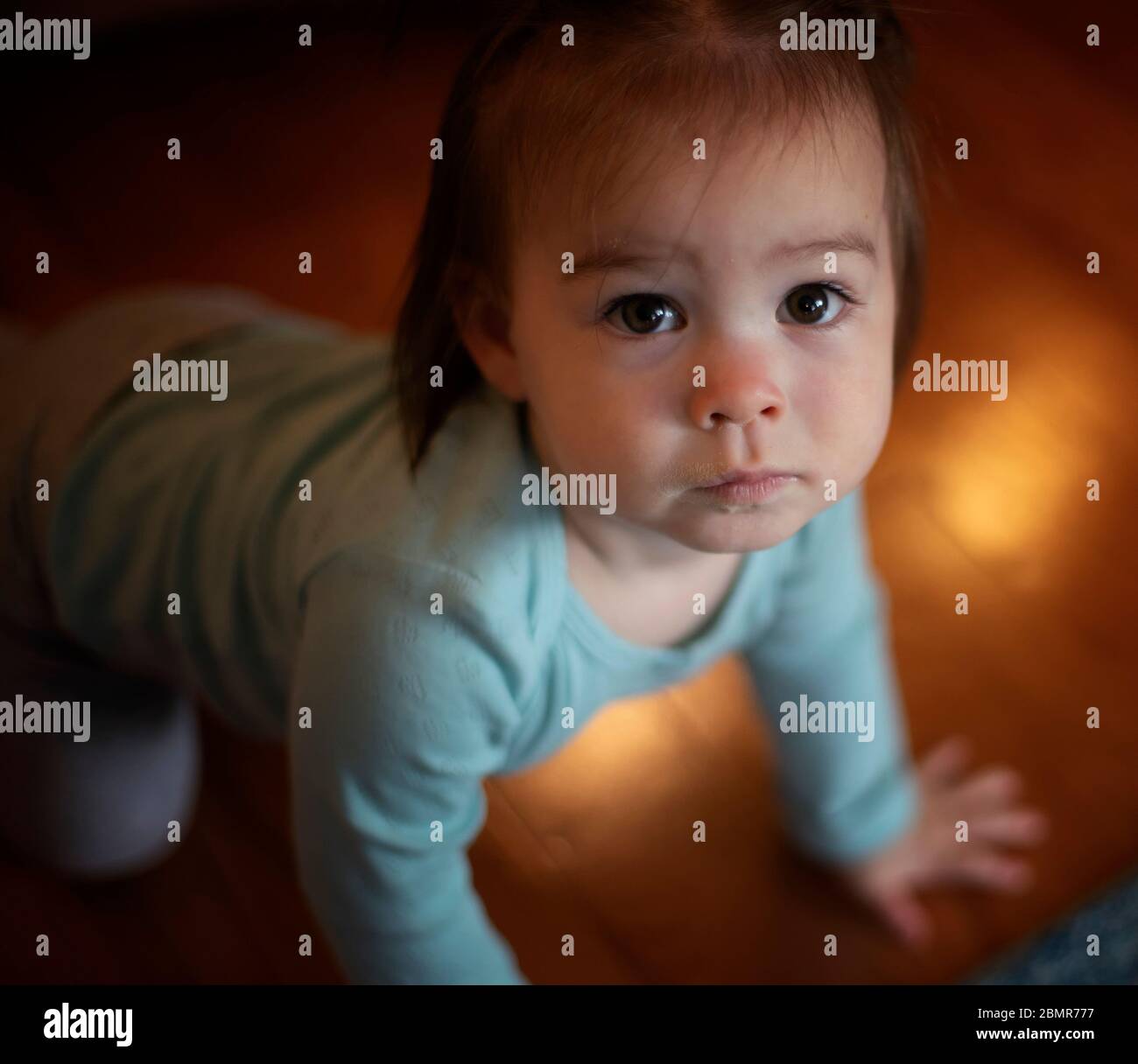 Crawling along the floor Stock Photo - Alamy