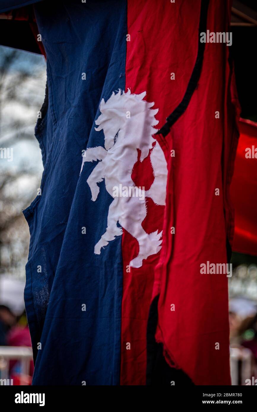 Medieval standard with a black and a white stripe and a white horse in ...