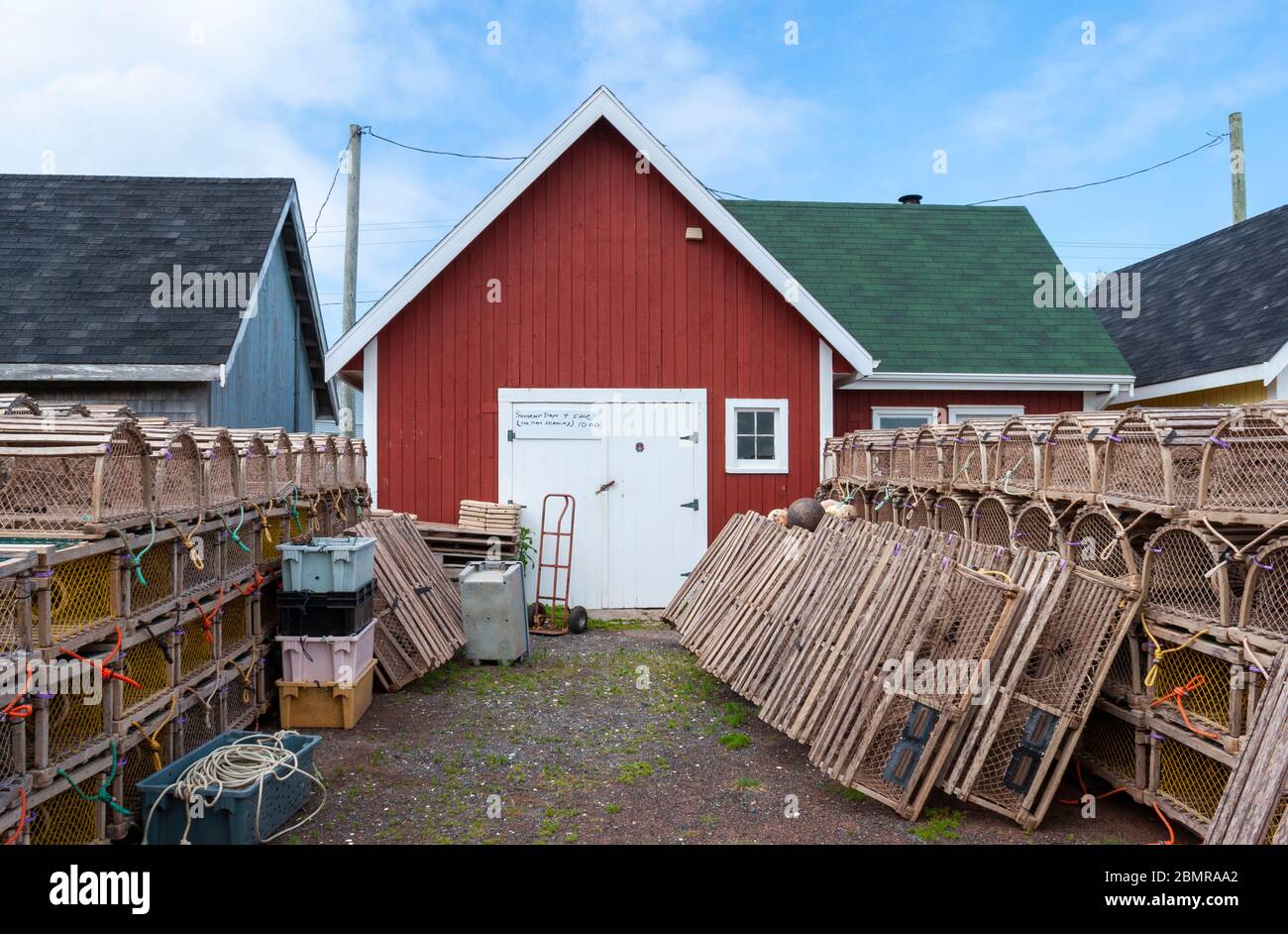 Picturesque fisherman's shack. Red-painted siding, green roof shingles ...