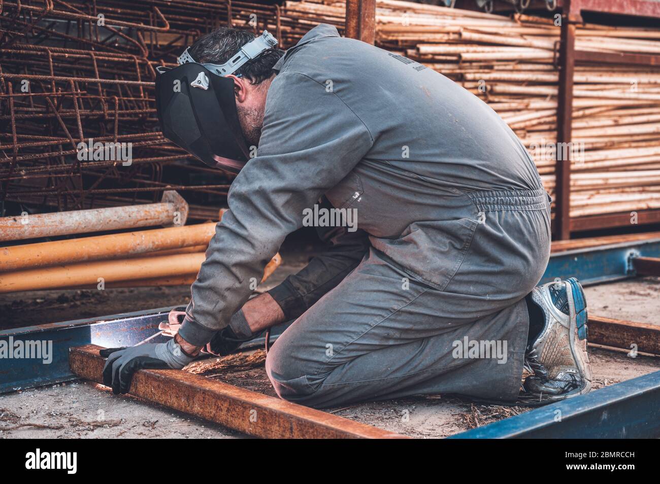 Welding work, Man Welding in Workshop. Metalwork and Sparks ...