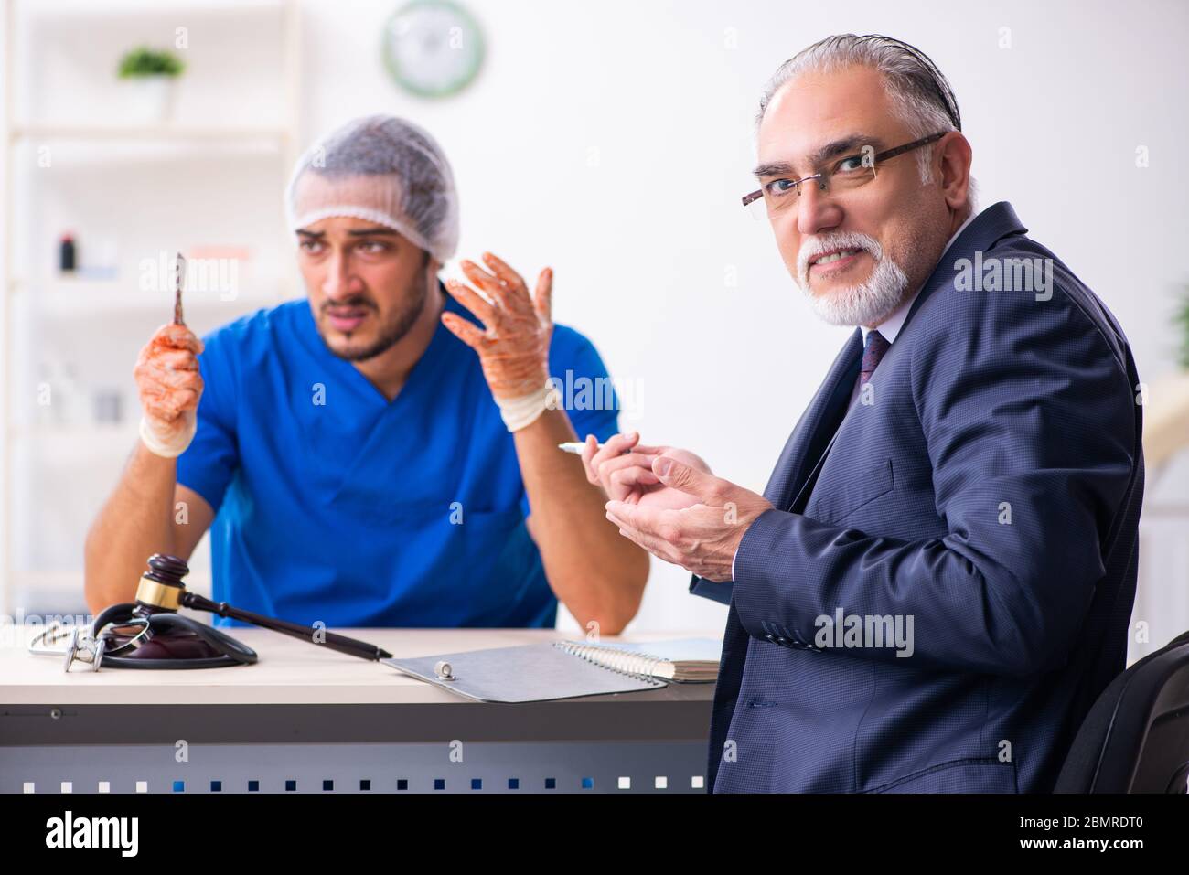 Doctor in courthouse meeting with advocate Stock Photo - Alamy