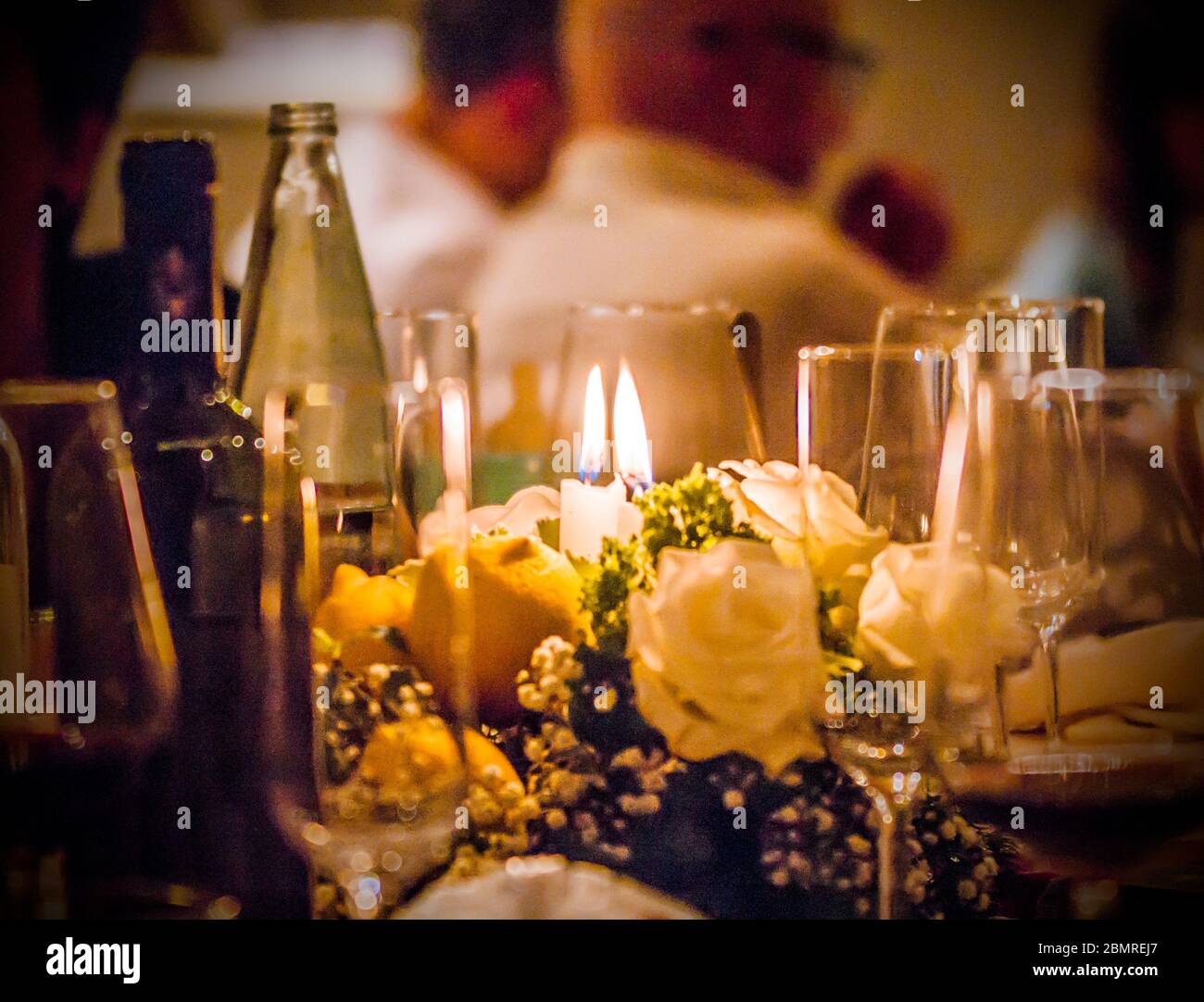 candle light illuminates the banquet table and gives the right ...