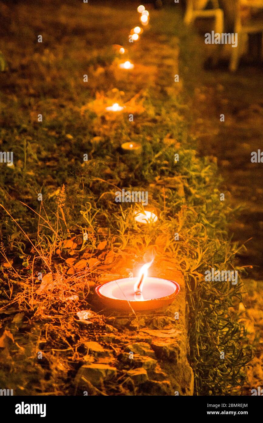 candle lights illuminate the path in the darkness of life and give hope ...