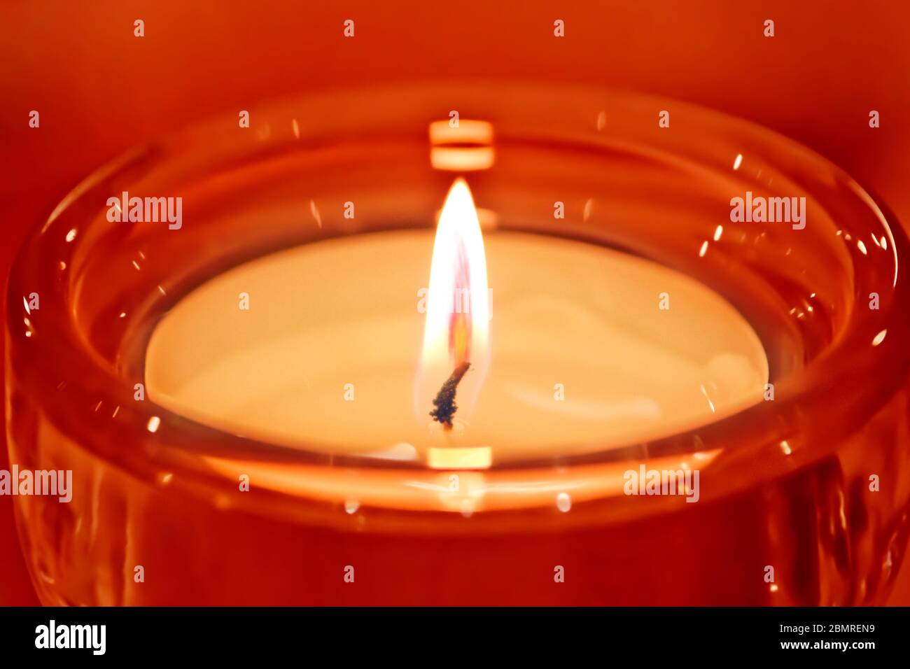 simple red candle illuminates the birth of jesus Stock Photo - Alamy