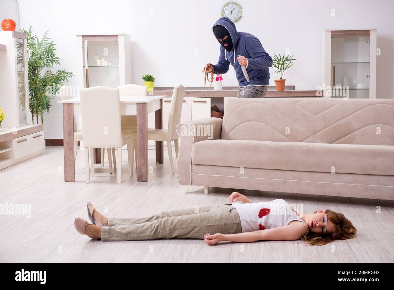 Gangster and woman in robbery concept Stock Photo - Alamy