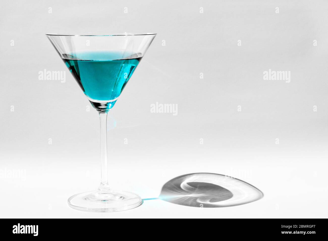 Rainbow of multiple bright color drinks in crystal clear martini ...