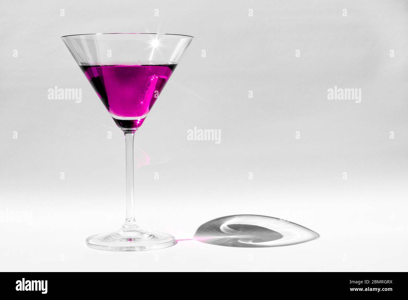 Rainbow of multiple bright color drinks in crystal clear martini ...